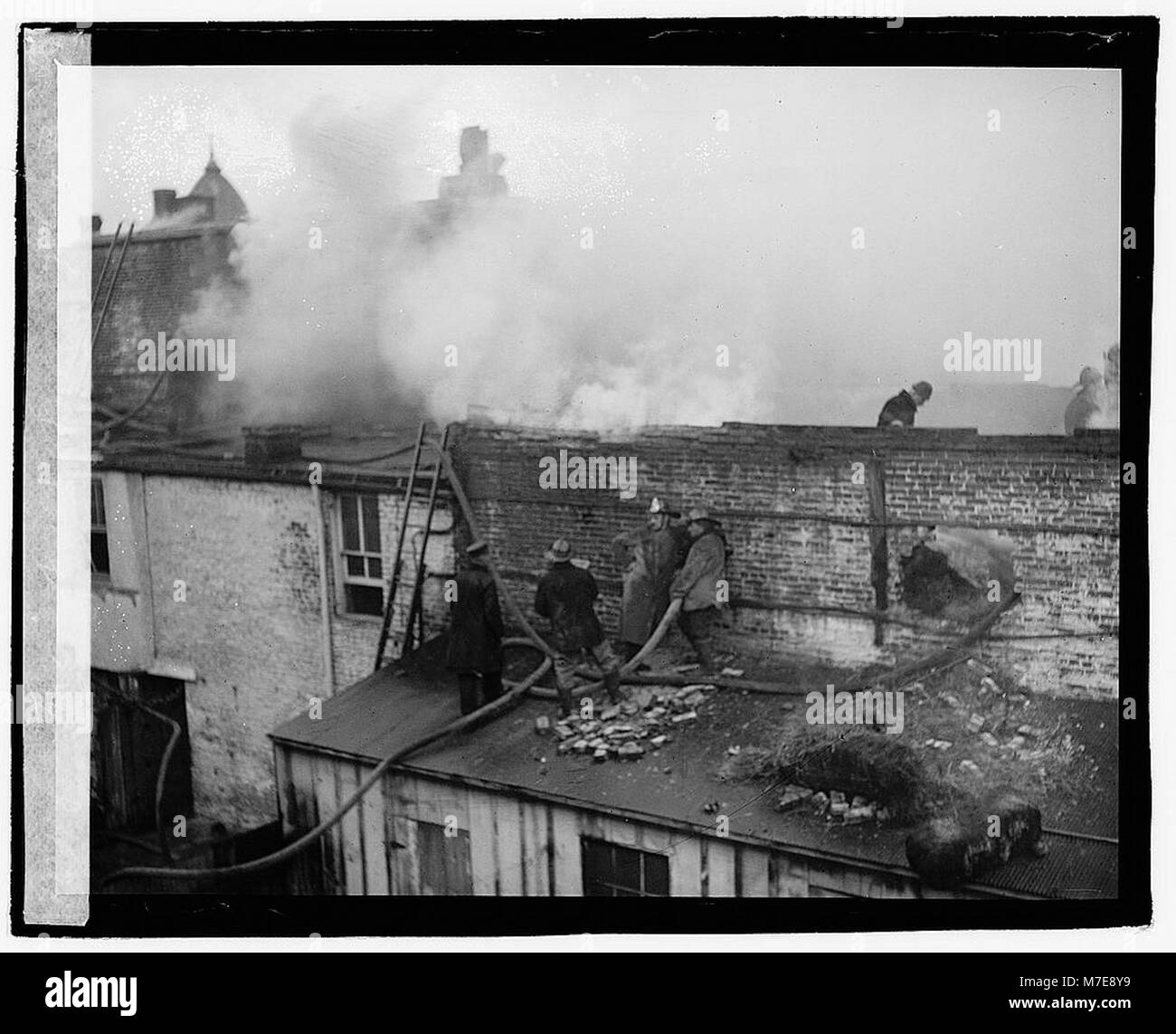 The image captures the aftermath of the Nixon Brewer fire at 7th and B ...