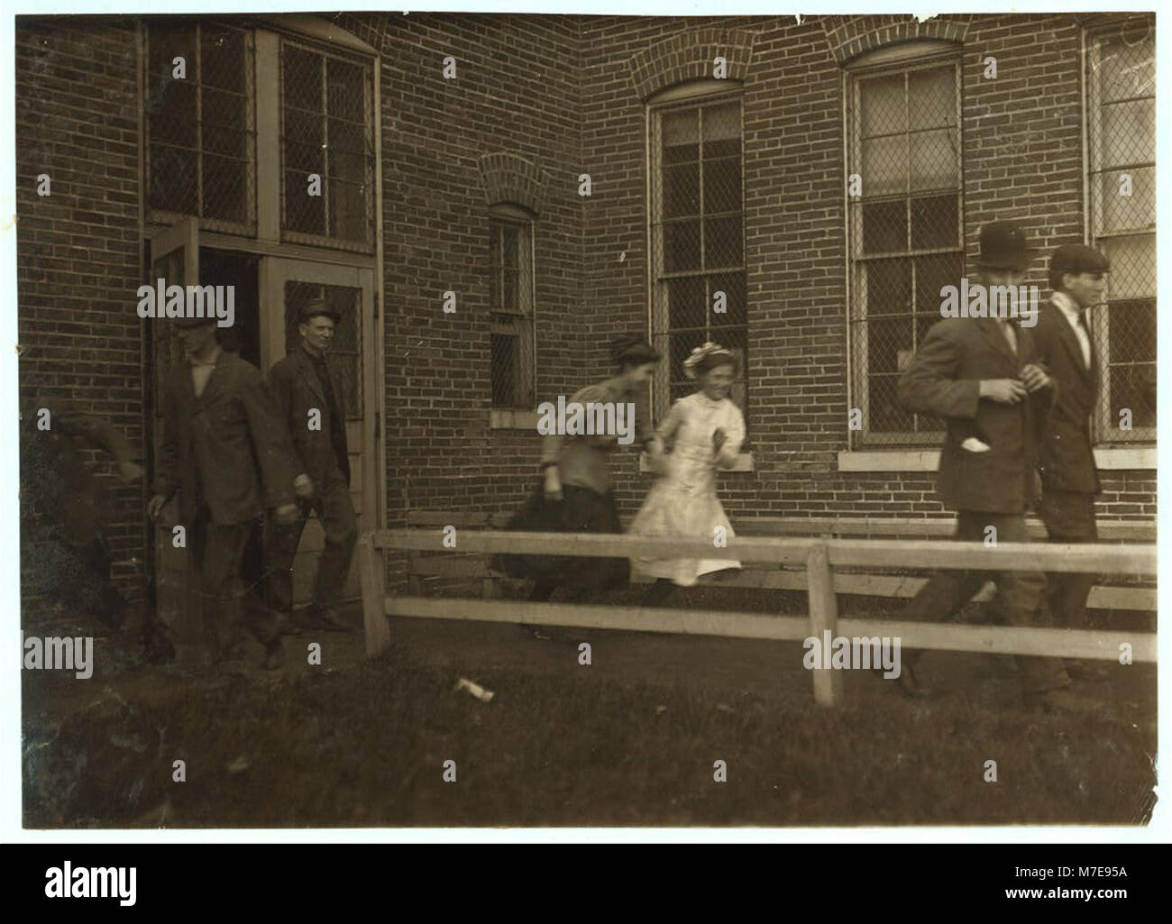 A photograph taken at noon at the Brown Shoe Factory, featuring a young ...