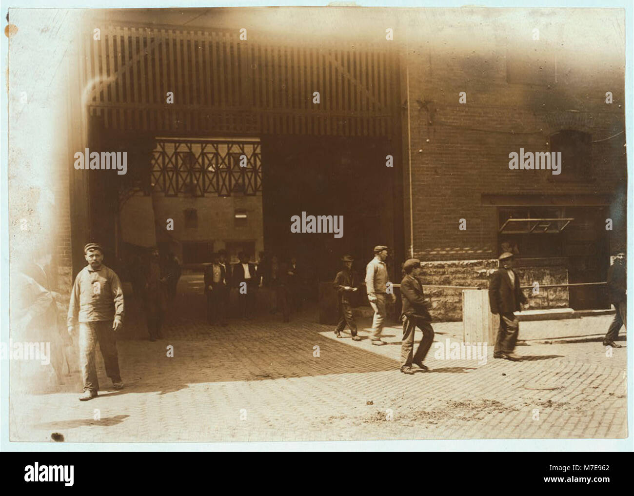 This historical photograph captures workers at a packing house in ...