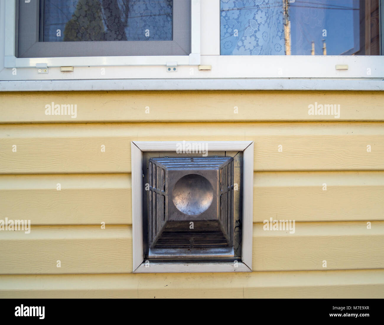 The output of the coaxial flue gas convector on the wall of the house ...