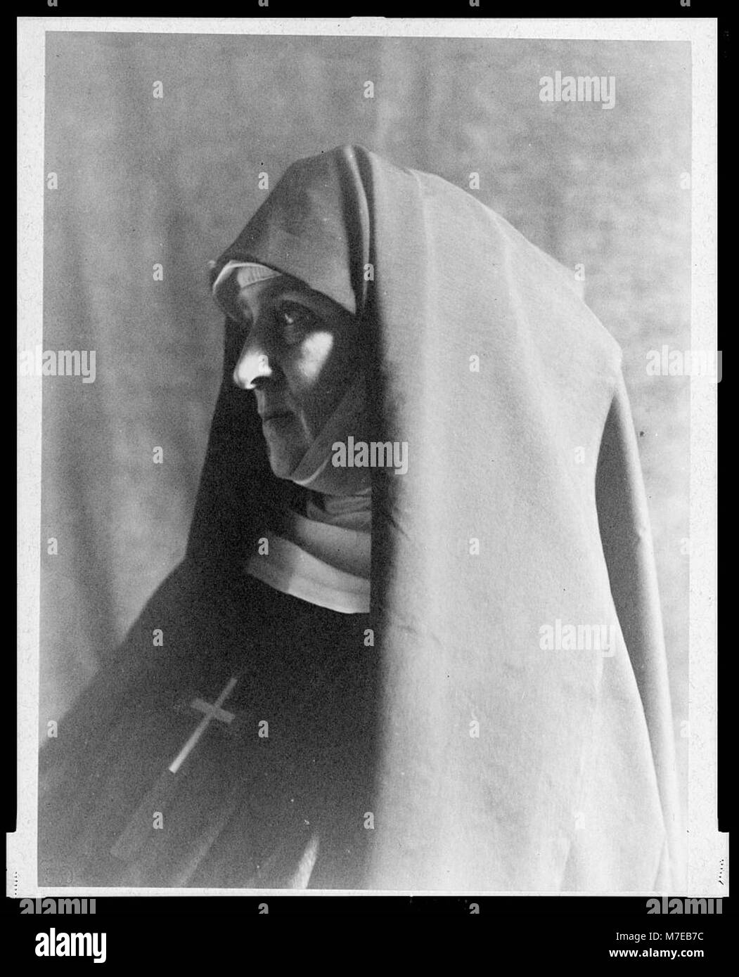 A profile portrait of a nun, capturing her religious attire and role in ...