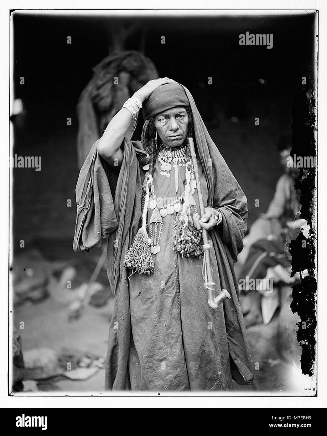 A photograph of an elderly Bedouin woman, capturing her traditional ...