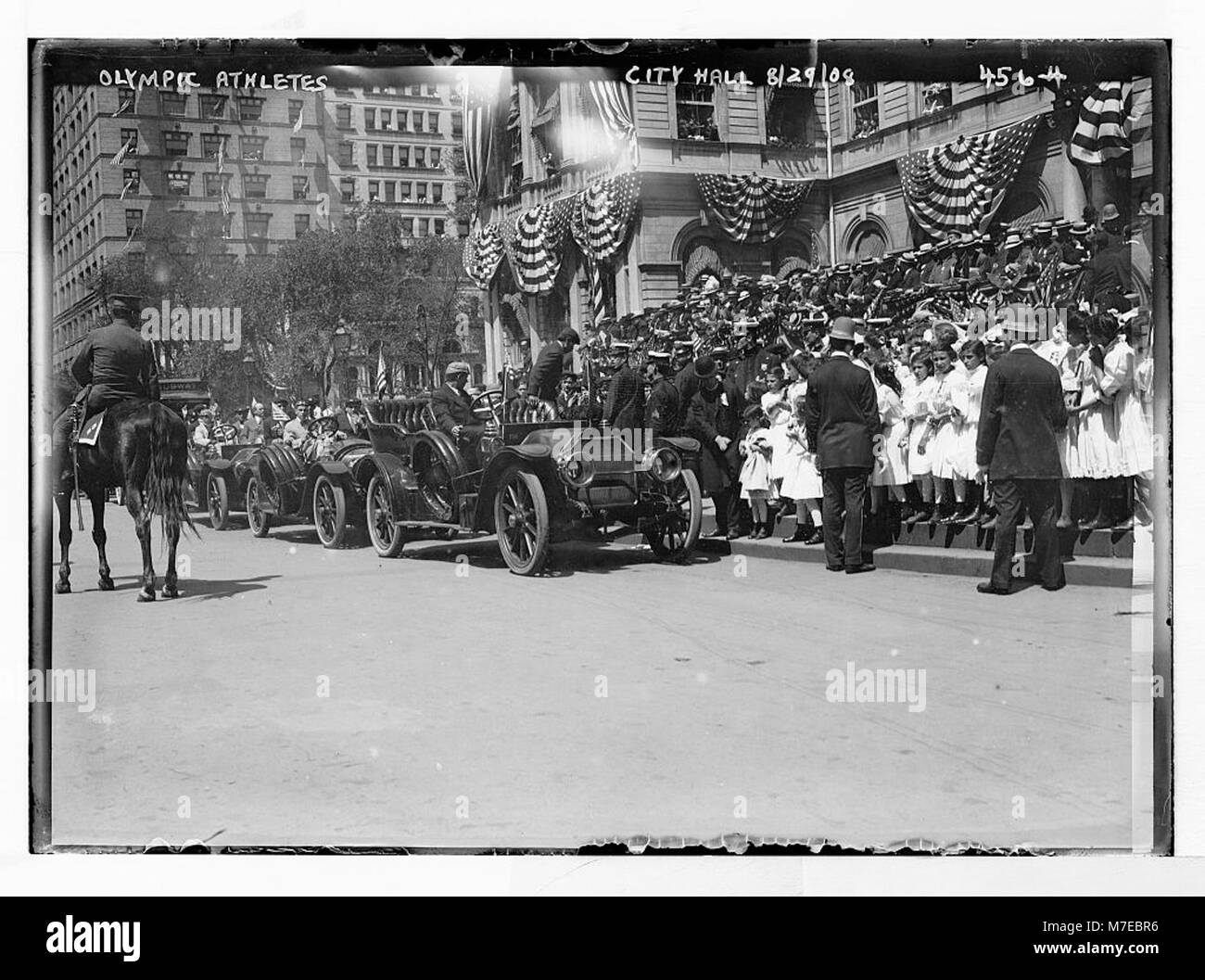 A gathering of Olympic athletes in front of City Hall, marking an ...