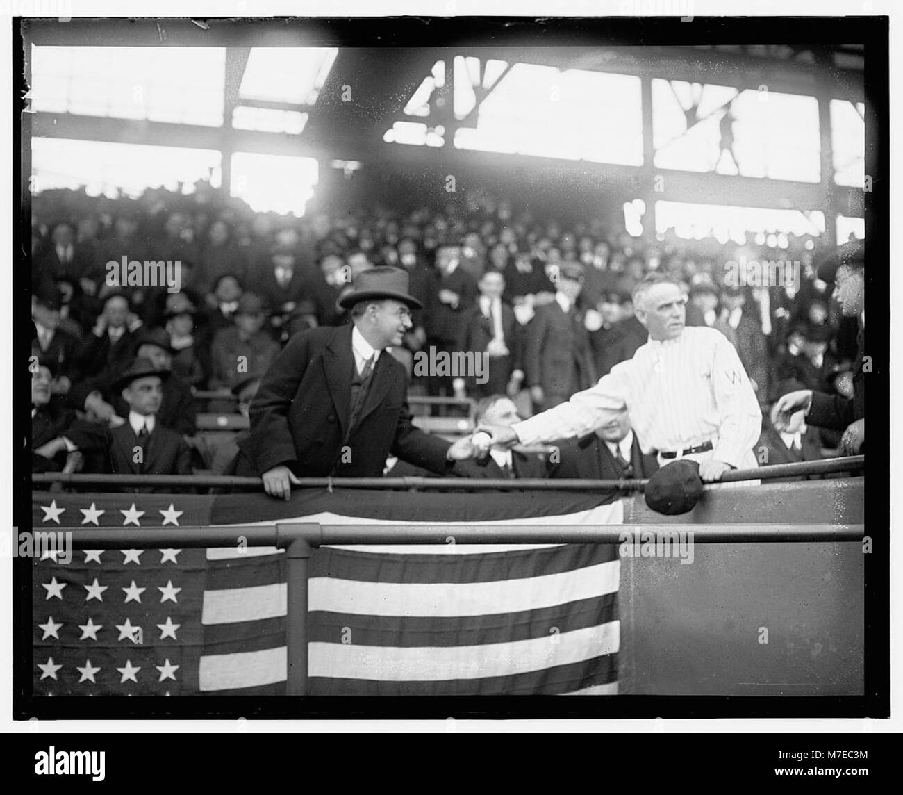 A photograph capturing the opening of a ballgame in 1918, an iconic ...