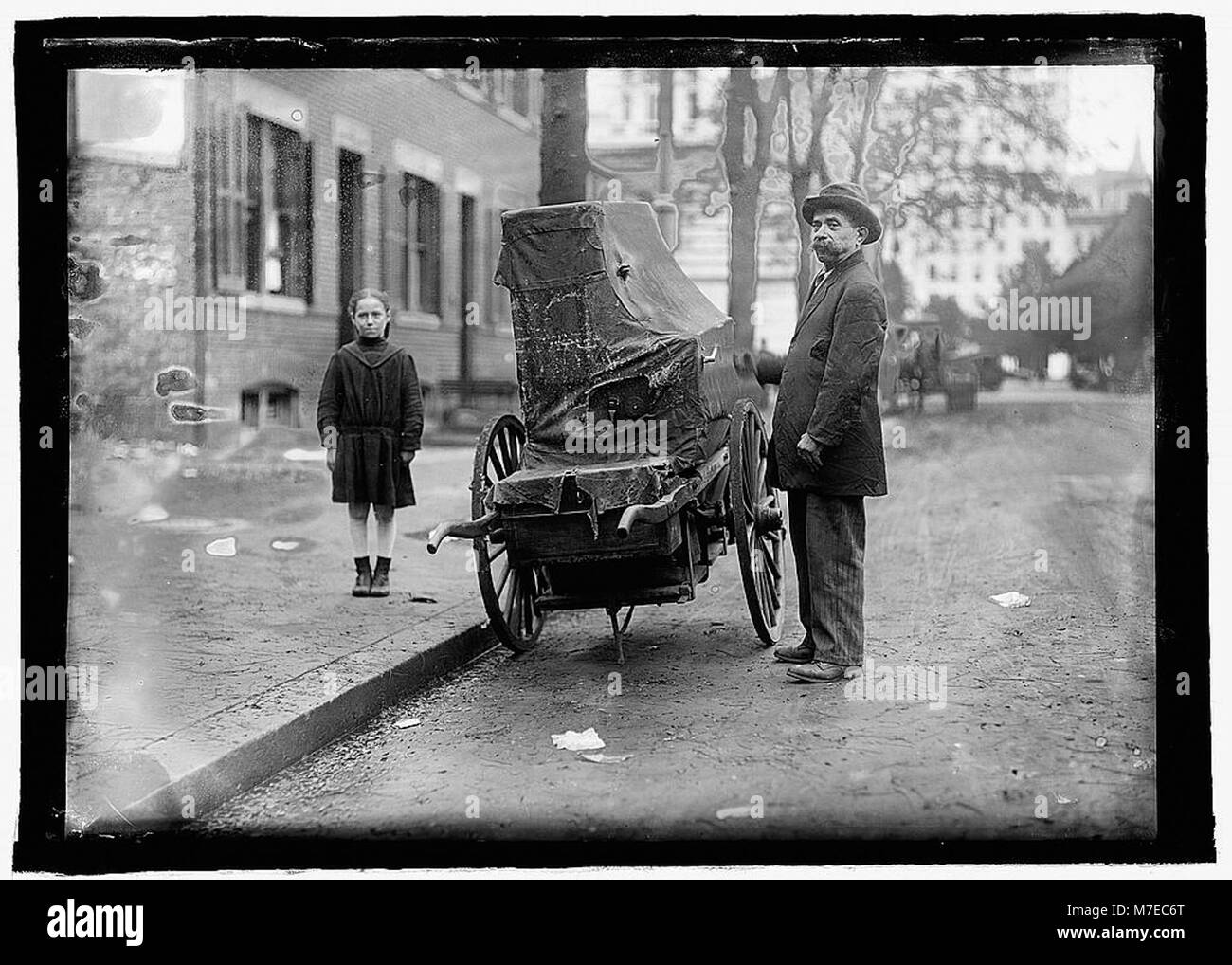 This image features an organ grinder, a popular street performer in the ...