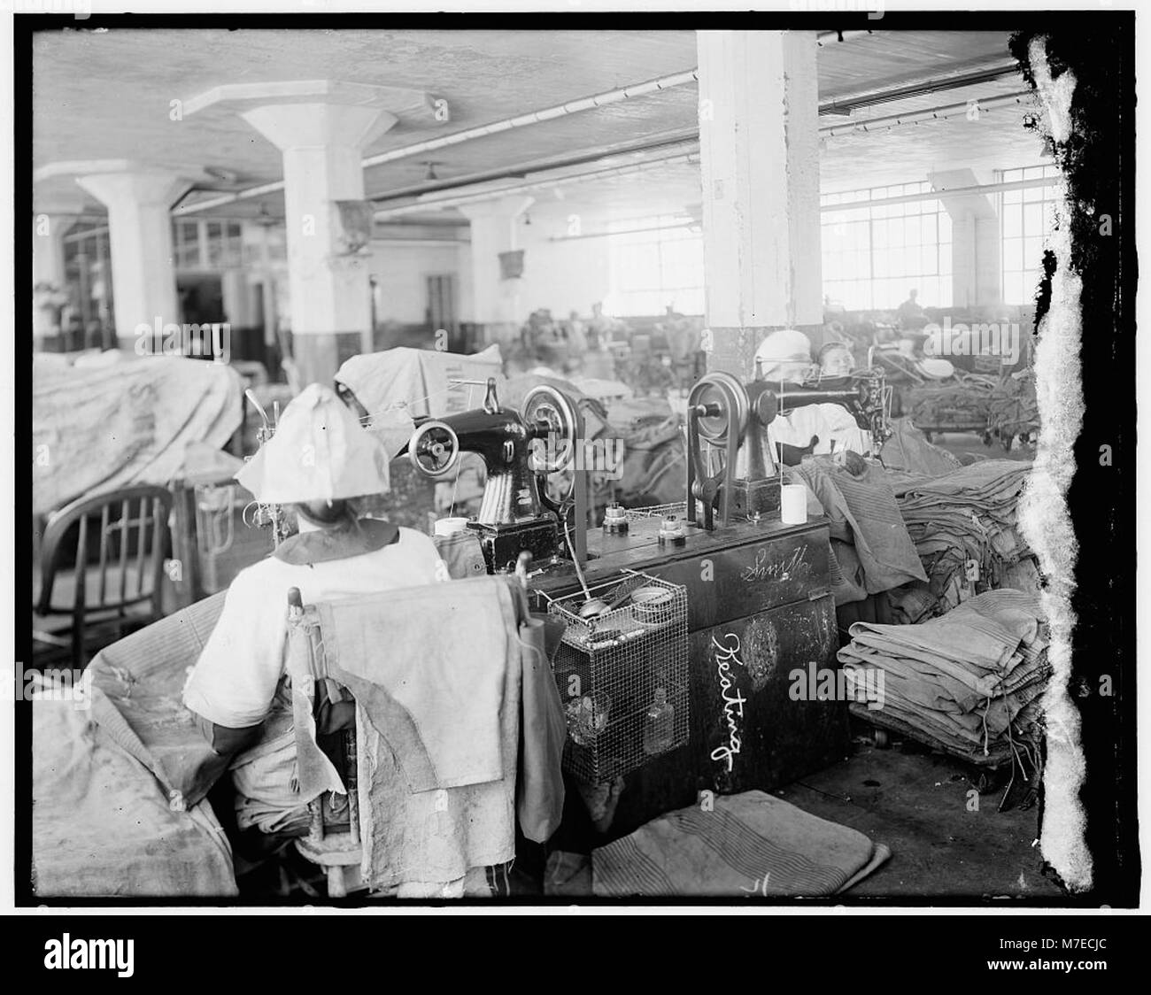 This image depicts a historical scene at a Post Office Department. The ...