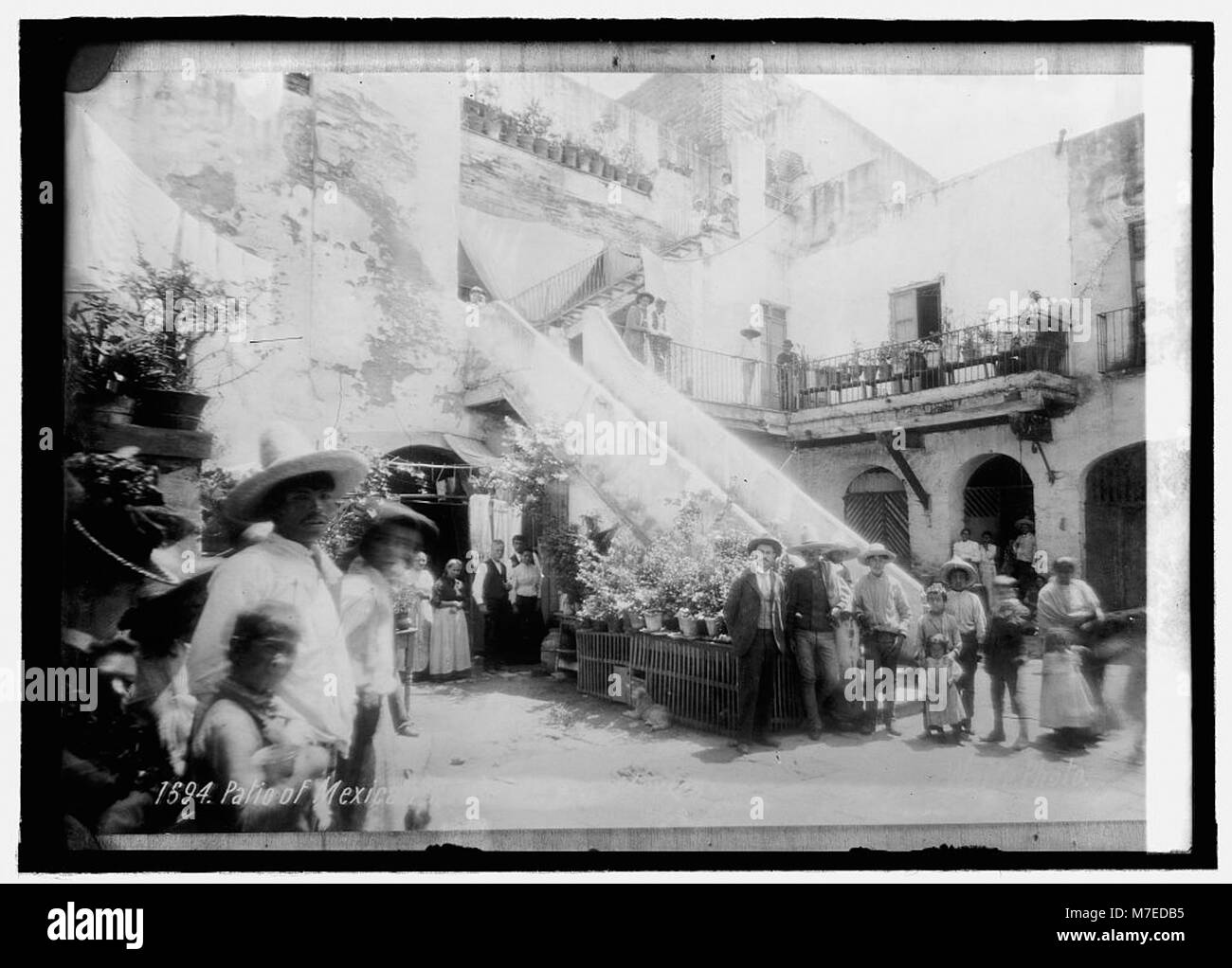 A photograph showing the patio of a tenement building in Mexico ...