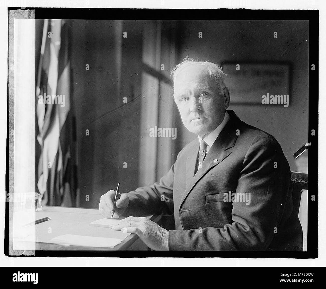 Pat Crowe, depicted at a desk, is shown in a personal or professional ...