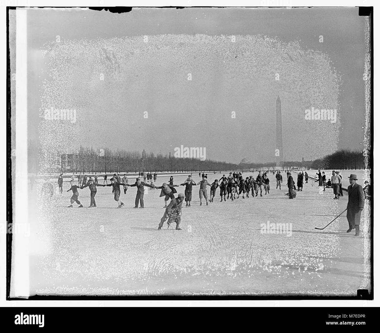 People are shown ice skating with the iconic Washington Monument in the ...