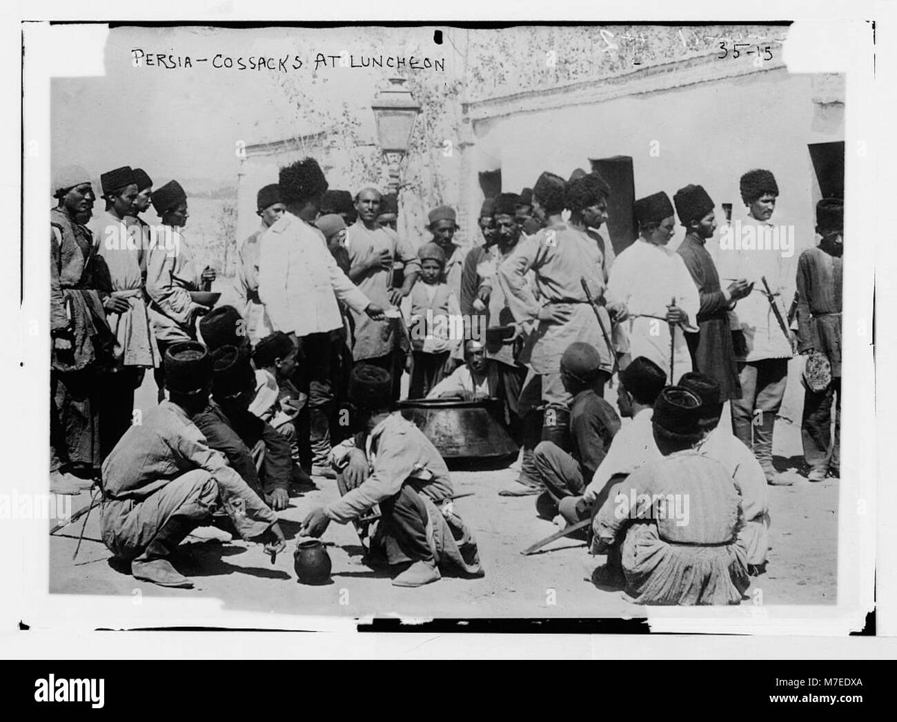 This image shows a group of Cossacks enjoying a luncheon in Persia. The ...