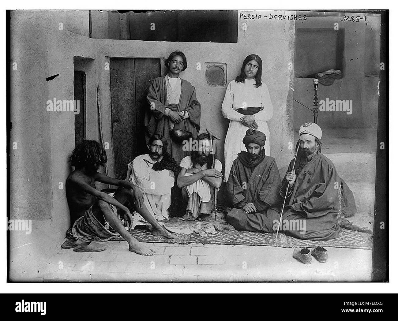 The image depicts a group of Dervishes in Persia, showcasing their ...