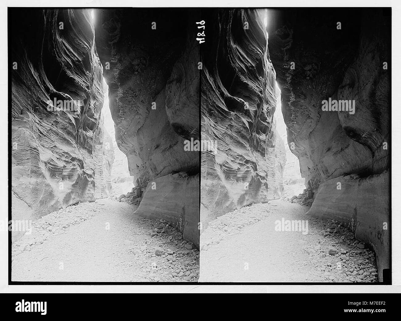 This photograph shows the dramatic cliffs of Petra's Siq, the narrow ...