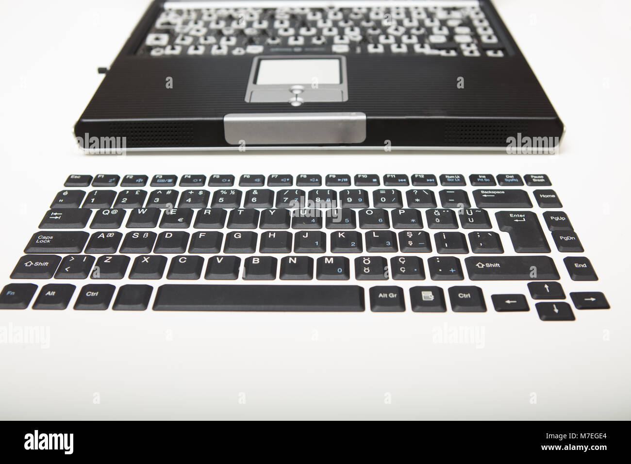 Disassembled laptop computer with the complete set of key covers from ...