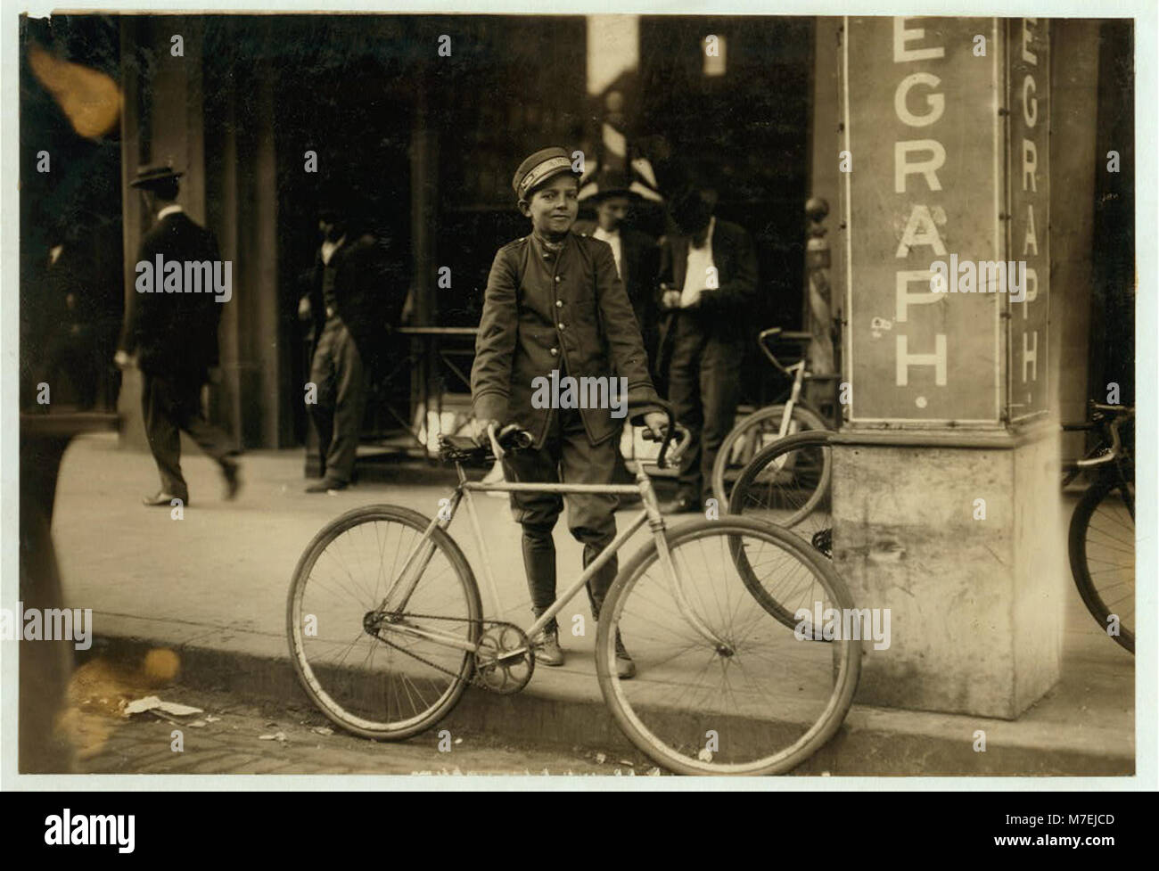A postal telegraph messenger, photographed in the early 20th century ...