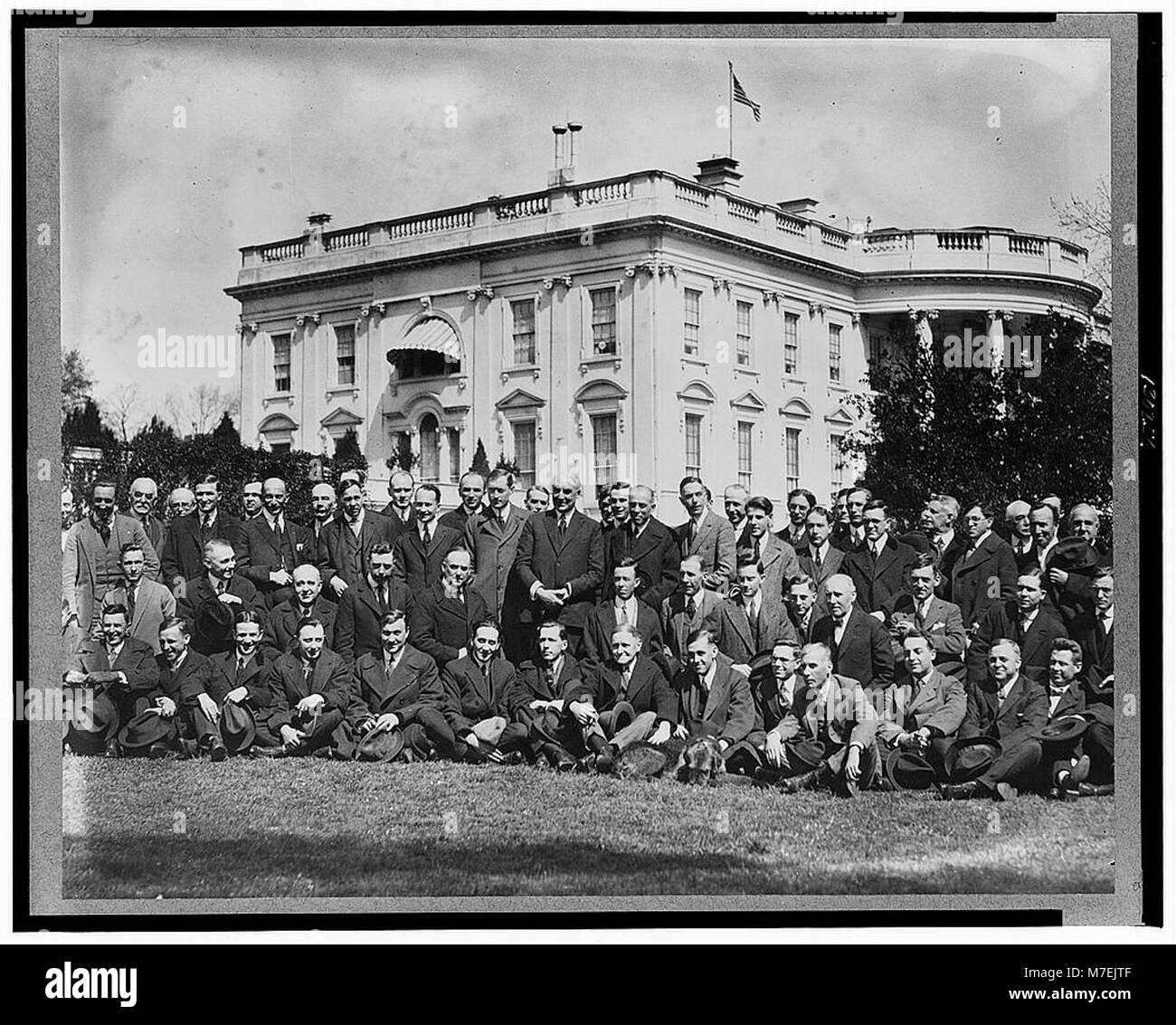 A photograph of President Warren G. Harding standing on the White House ...