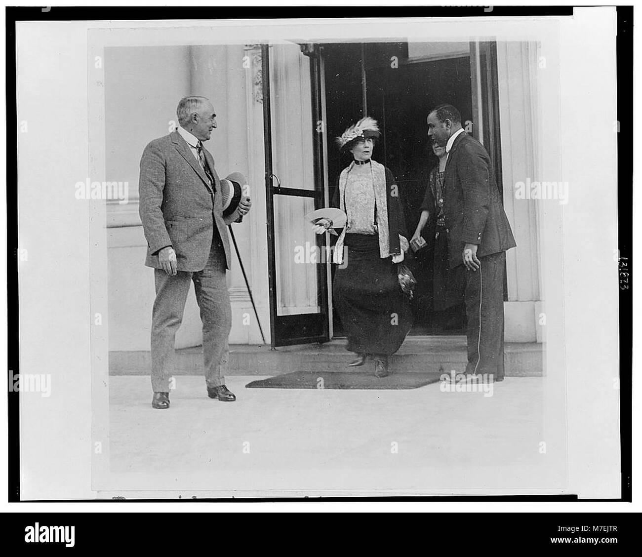 A moment captured of President Harding standing while Mrs. Harding bids ...