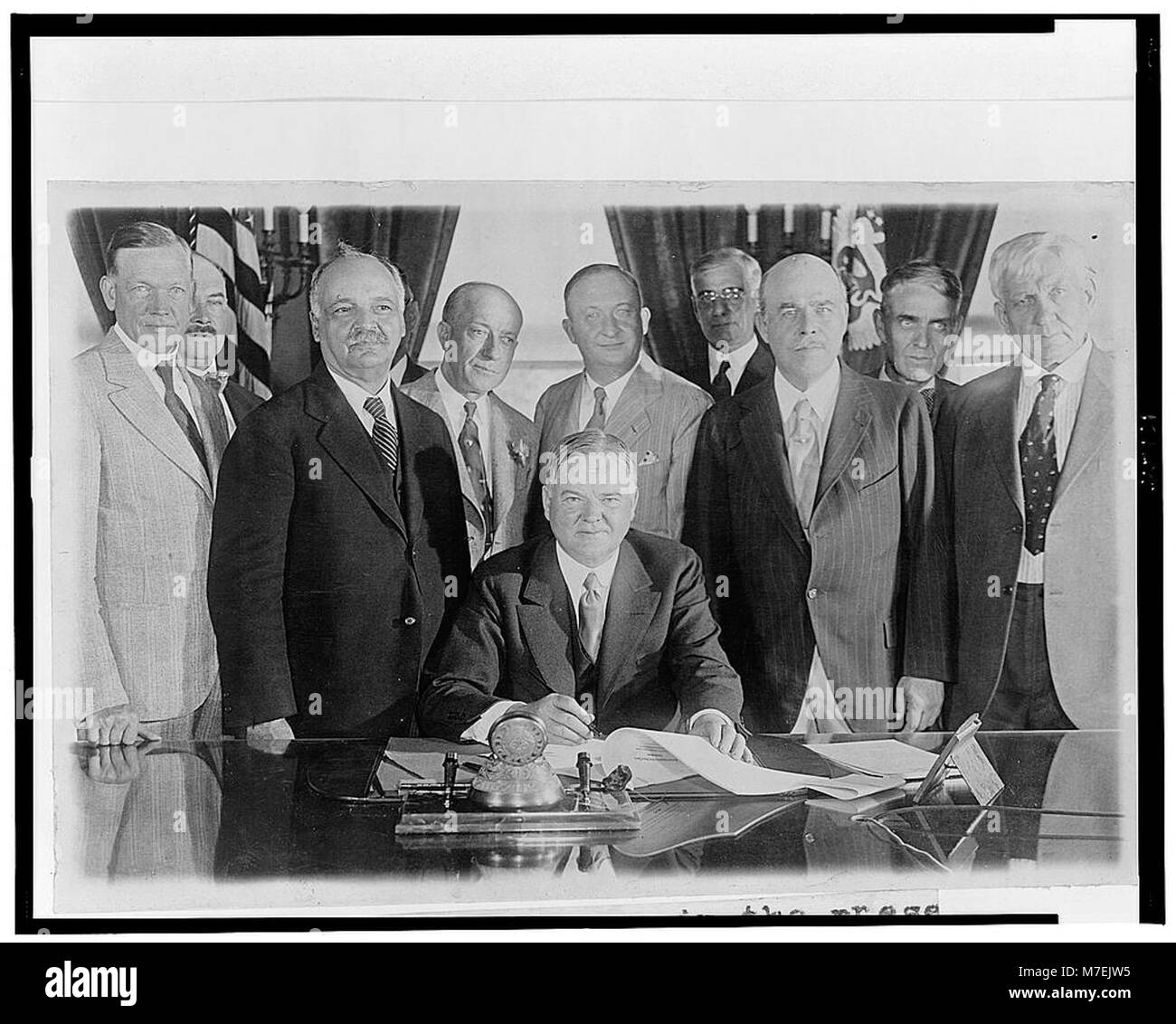 President Herbert Hoover is shown alongside Congressional leaders ...
