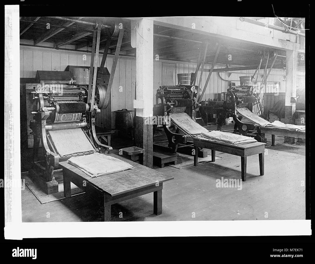 The image depicts printing presses used to print sugar containers ...