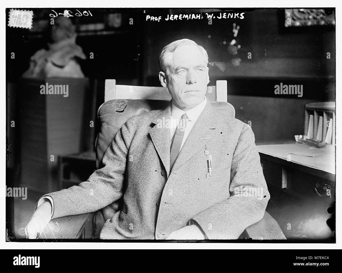 A photograph of Professor Jeremiah W. Jenks seated, likely in a ...