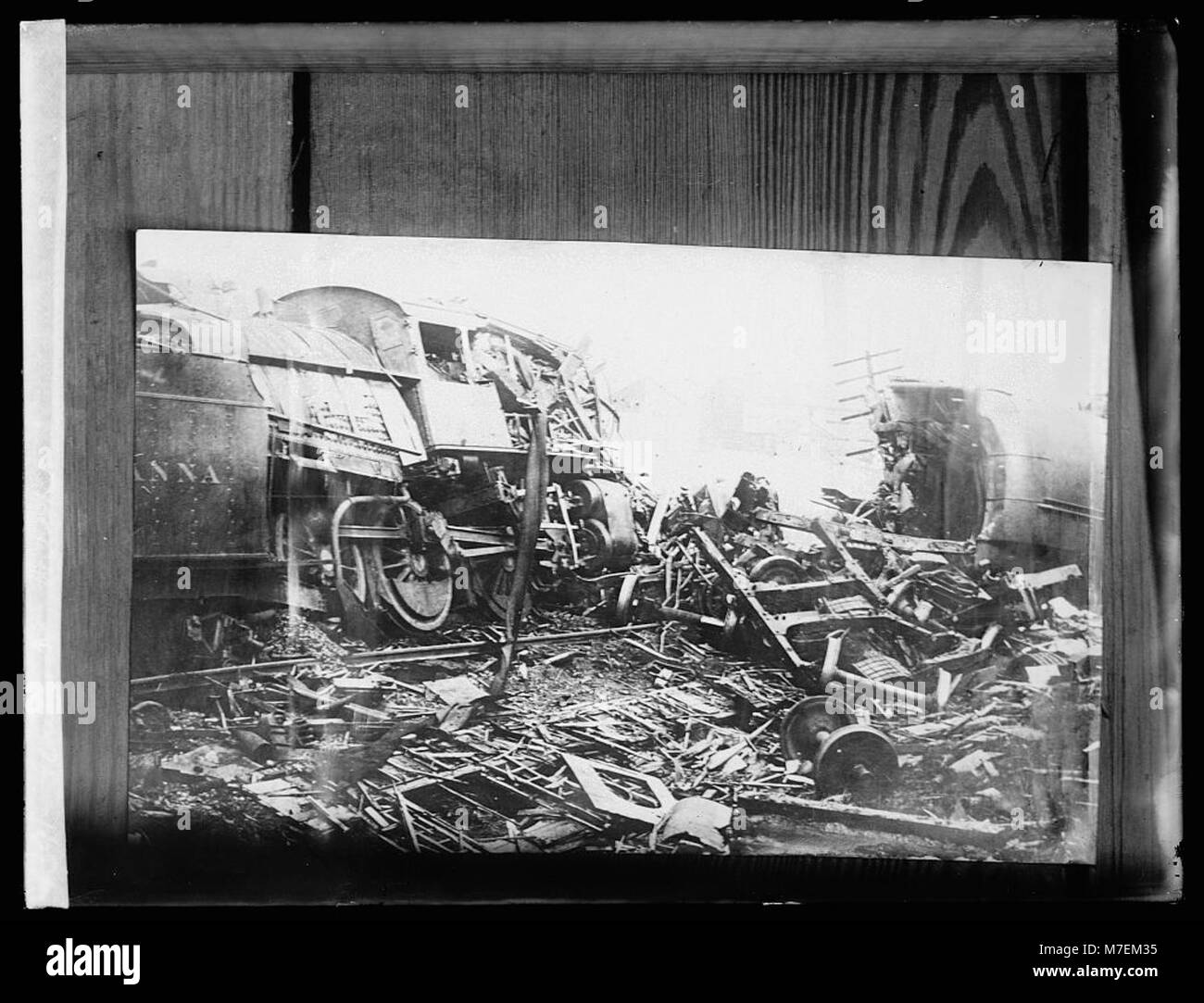 A photograph depicting a railroad wreck, showcasing the aftermath of ...