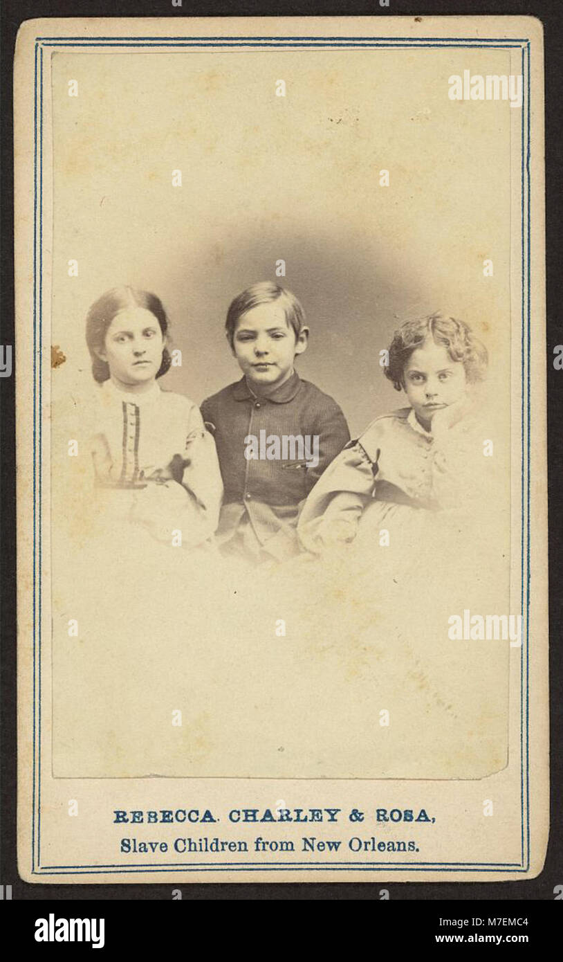 The photograph depicts Rebecca, Charley, and Rosa, enslaved children ...