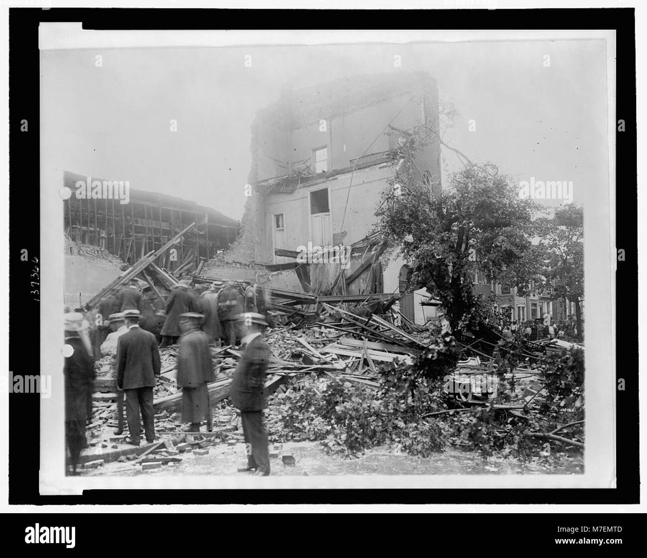 A photograph of a building's remains after a storm, showing the ...