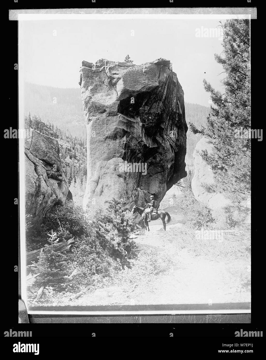 A scenic view of a boulder on a trail in Rocky Mountain National Park ...