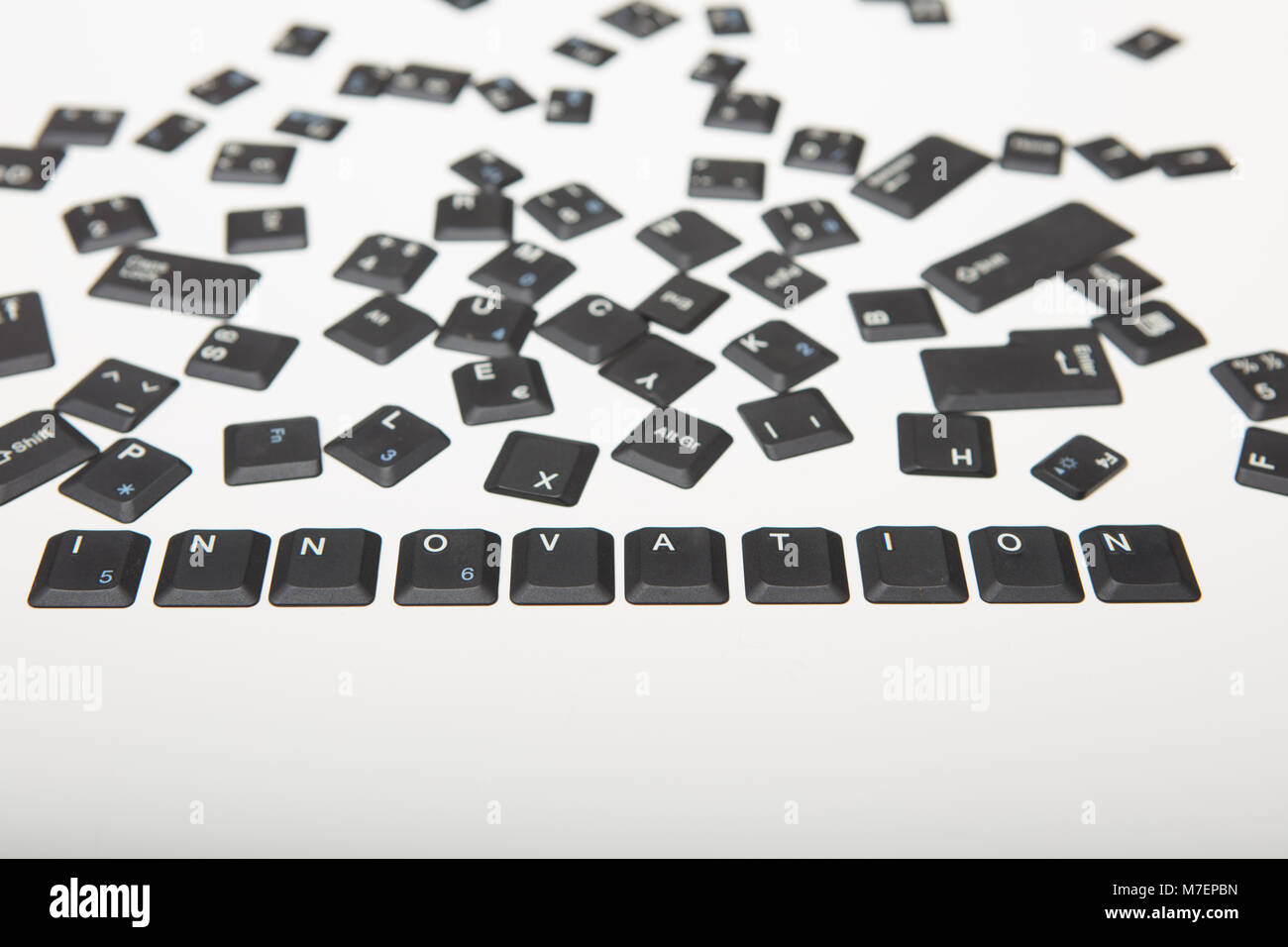 Computer keyboard composed of loose key covers from a computer with the ...