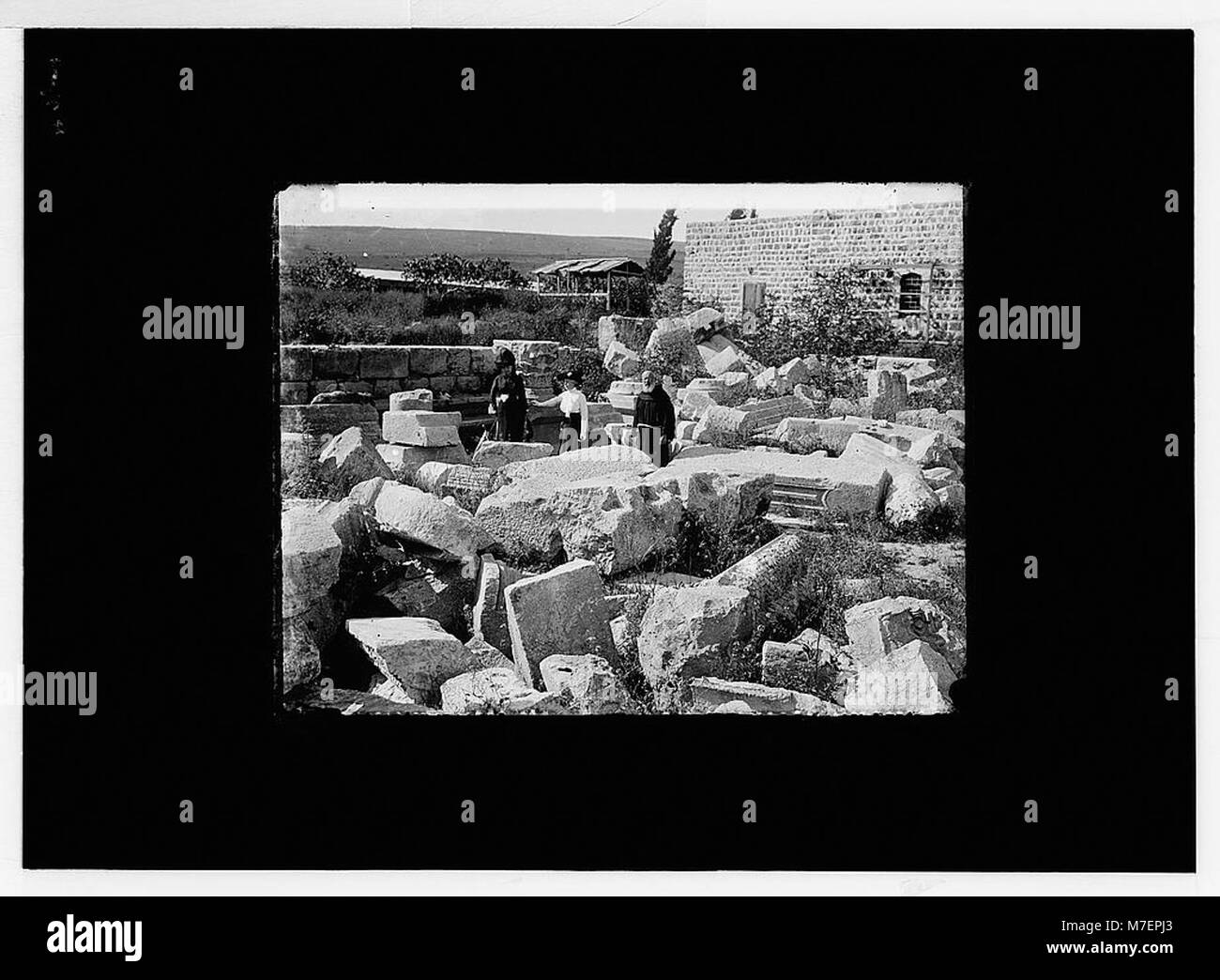 The image captures the ruins of the ancient synagogue at Capernaum ...