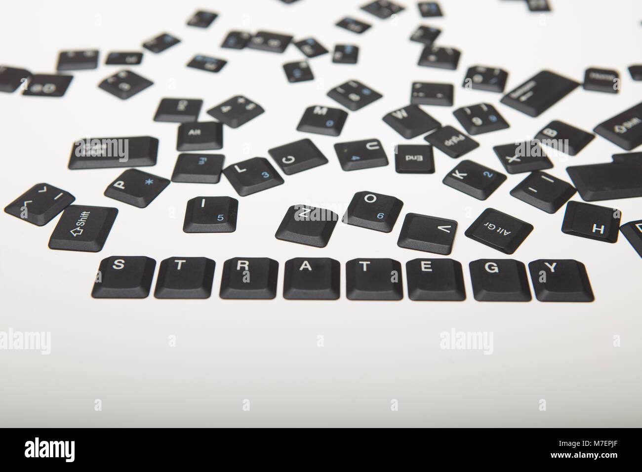 Computer keyboard composed of loose key covers from a computer with the ...