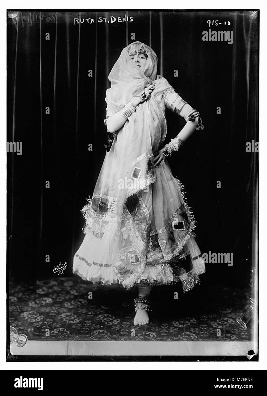 This image features Ruth St. Denis, a renowned American dancer and ...