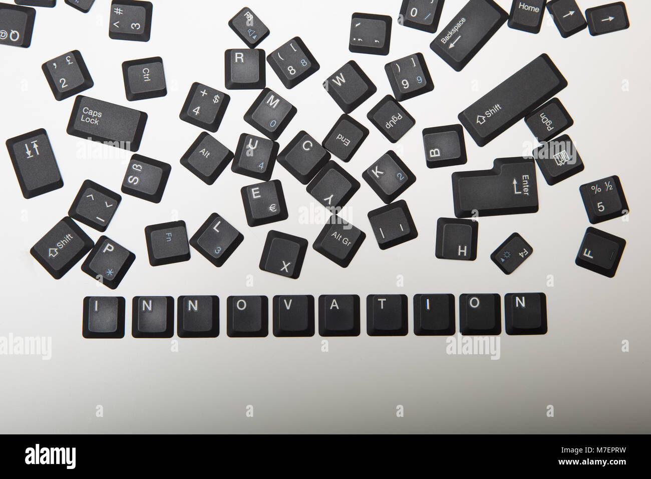 Computer keyboard composed of loose key covers from a computer with the ...