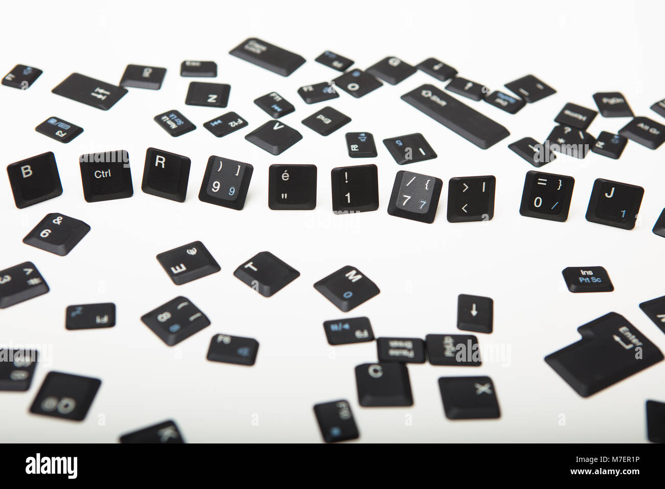 Computer keyboard composed of loose key covers from a computer with the ...