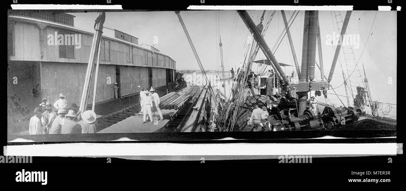 Workers load coffee beans at a port in Salvador, La Union, a key site ...
