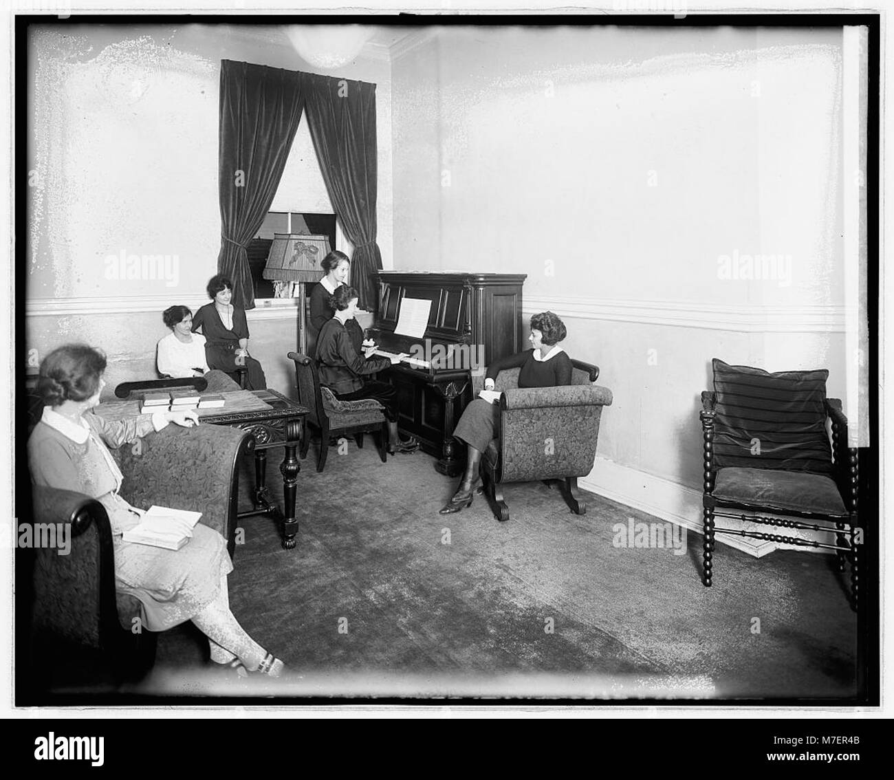 A historical photograph showing the parlor of the Dewey Hotel in ...