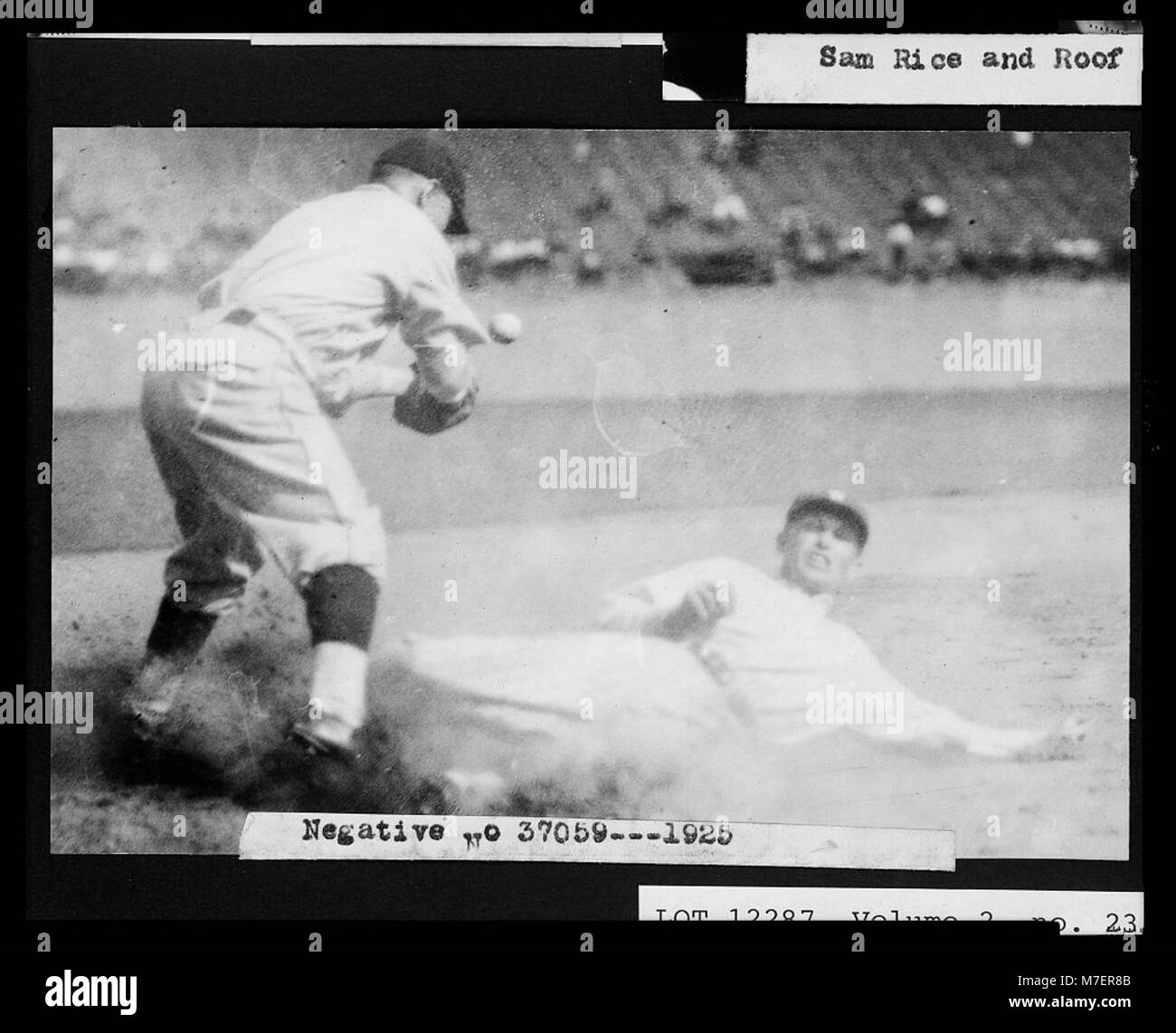 This image captures Sam Rice of the Washington Nationals sliding into ...