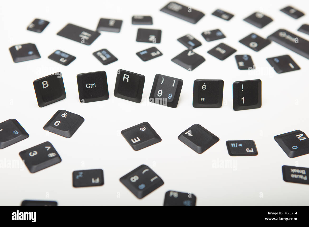 Computer keyboard composed of loose key covers from a computer with the ...