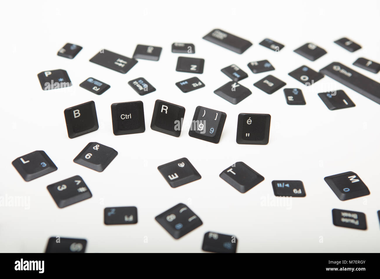 Computer keyboard composed of loose key covers from a computer with the ...