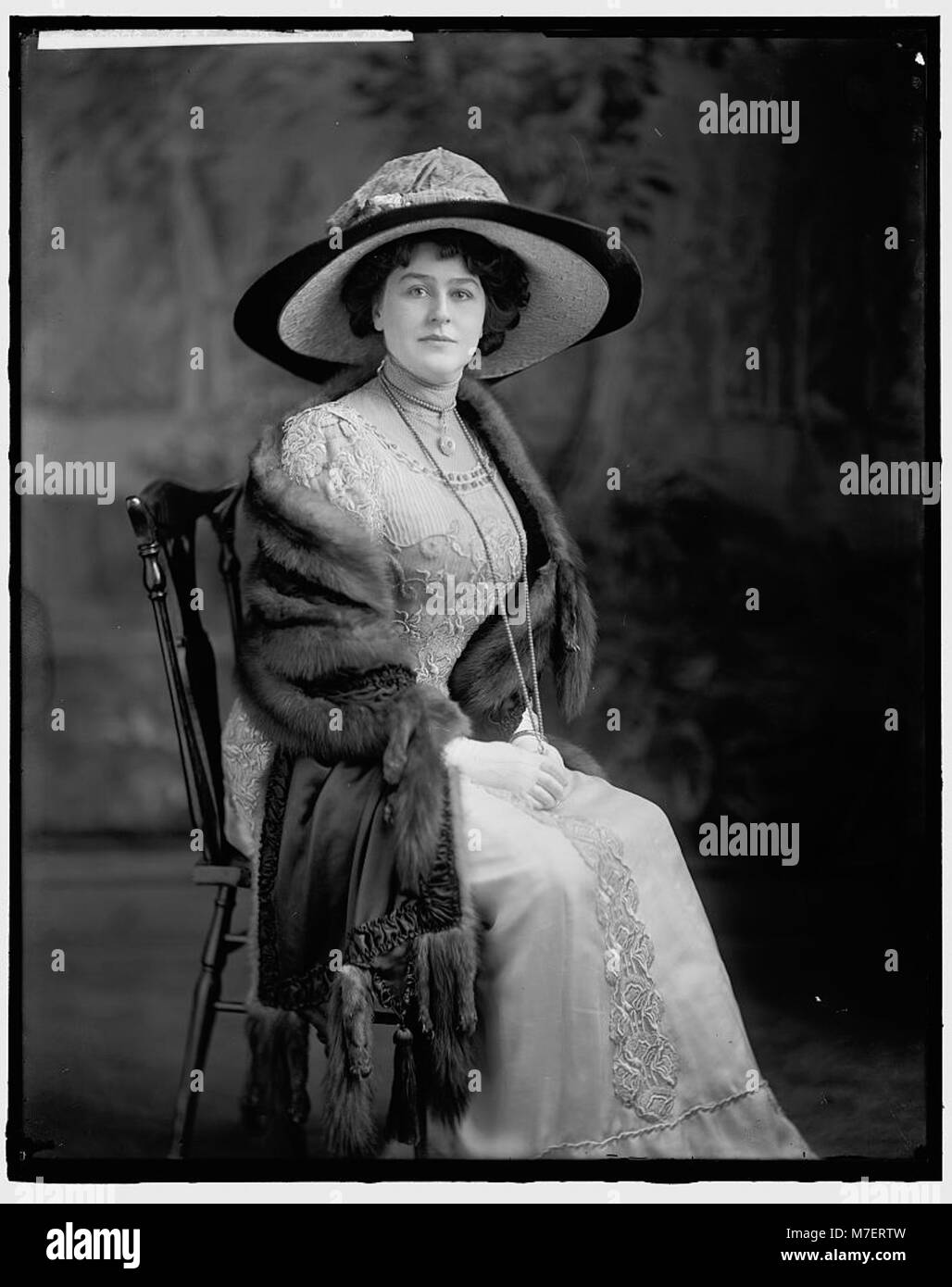 A portrait of Mrs. A.W. Scott Jr., capturing her social and familial ...