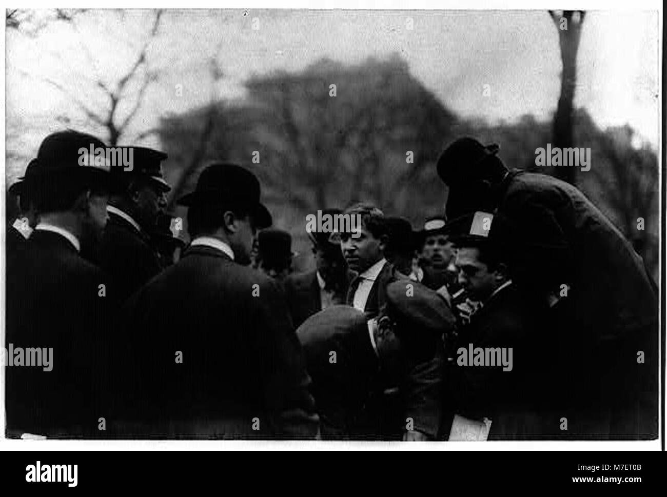 A historical image showing the search of a suspect named Dalinger ...