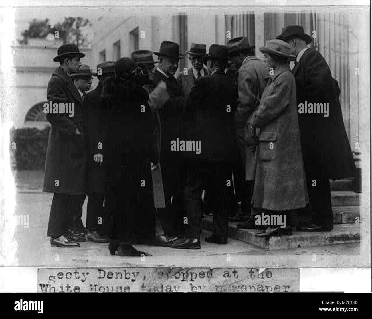 Secretary Denby at the White House surrounded by reporters, announcing ...