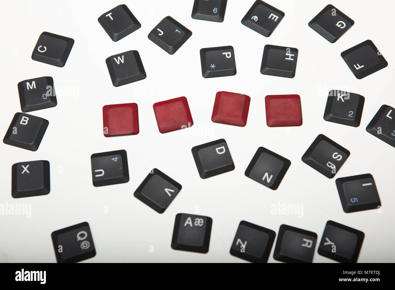 Overhead view of a composed alphanumeric computer keyboard with four ...