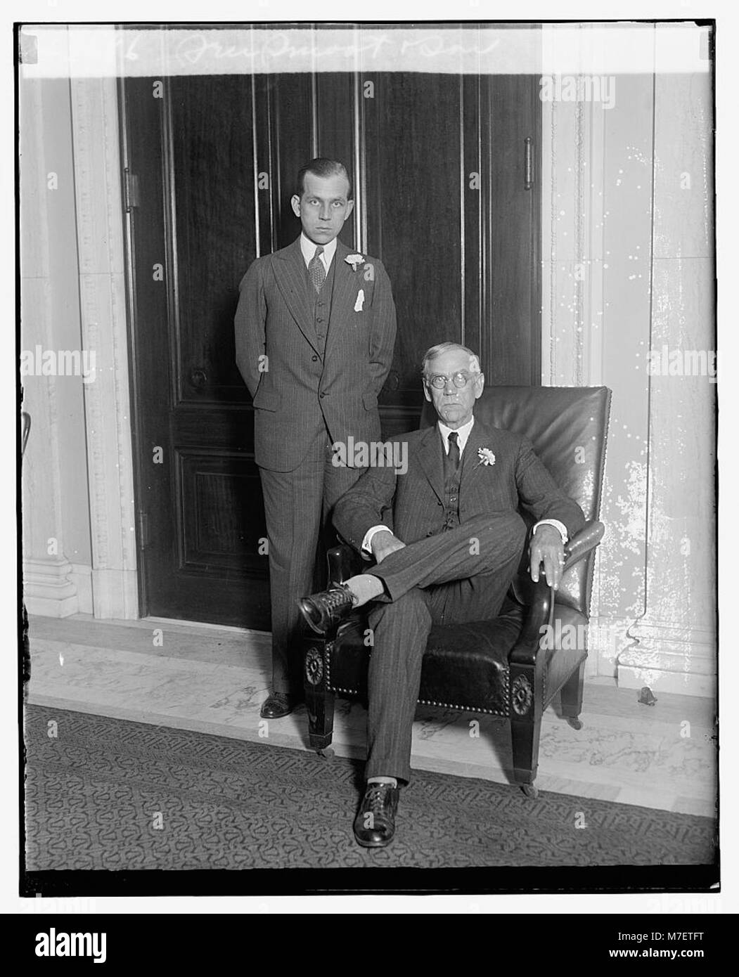 A photograph of Senator Reed Smoot with his son, capturing a moment in ...