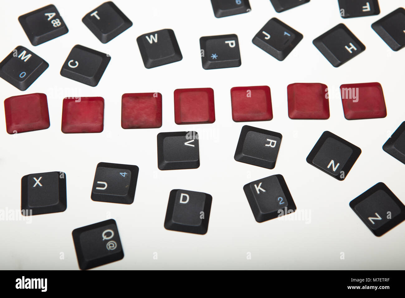Overhead view of a composed alphanumeric computer keyboard with seven ...