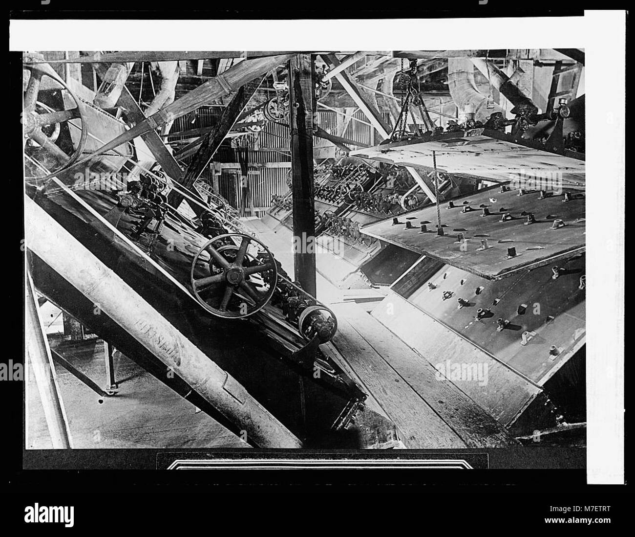 This image depicts sugar grain separators, with one open to show three ...