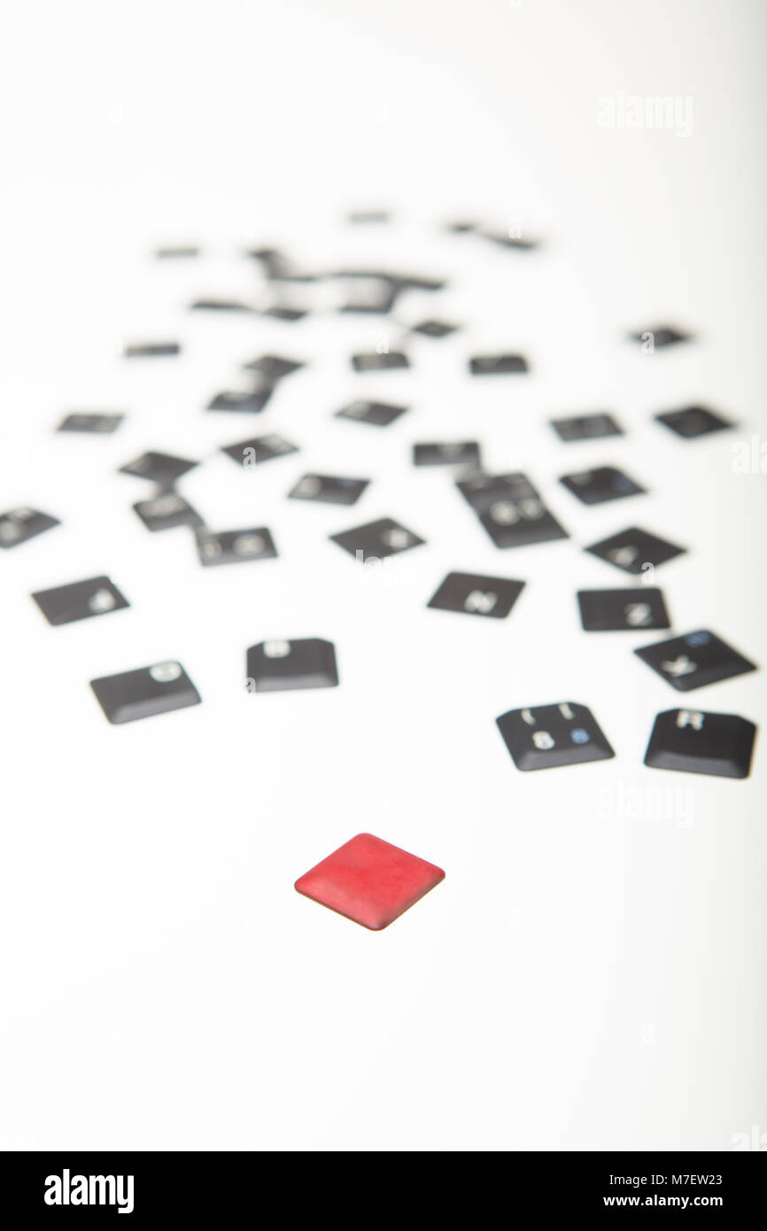 Random scattered loose computer keyboard key covers receding into the ...