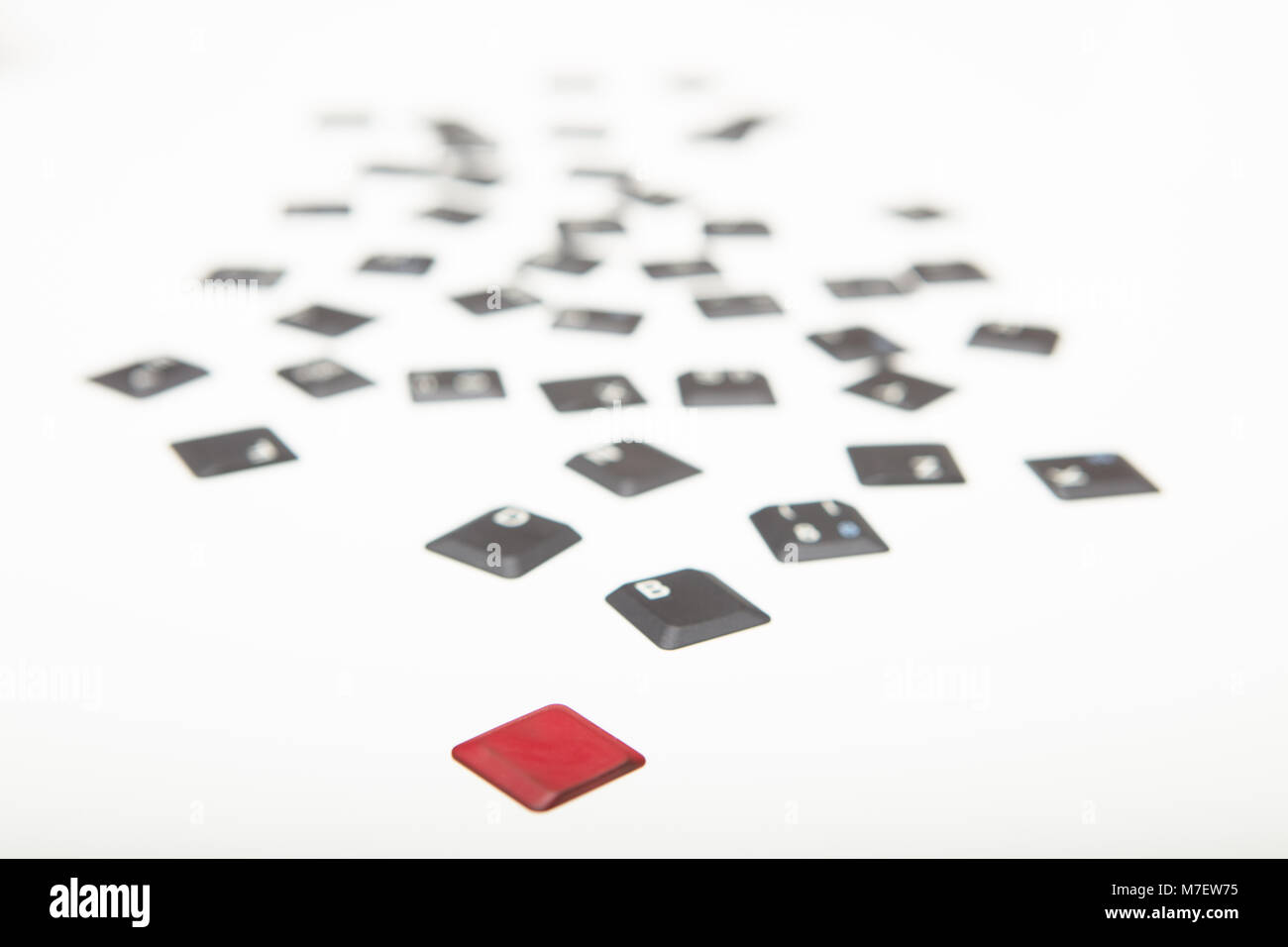 Random scattered loose computer keyboard key covers receding into the ...