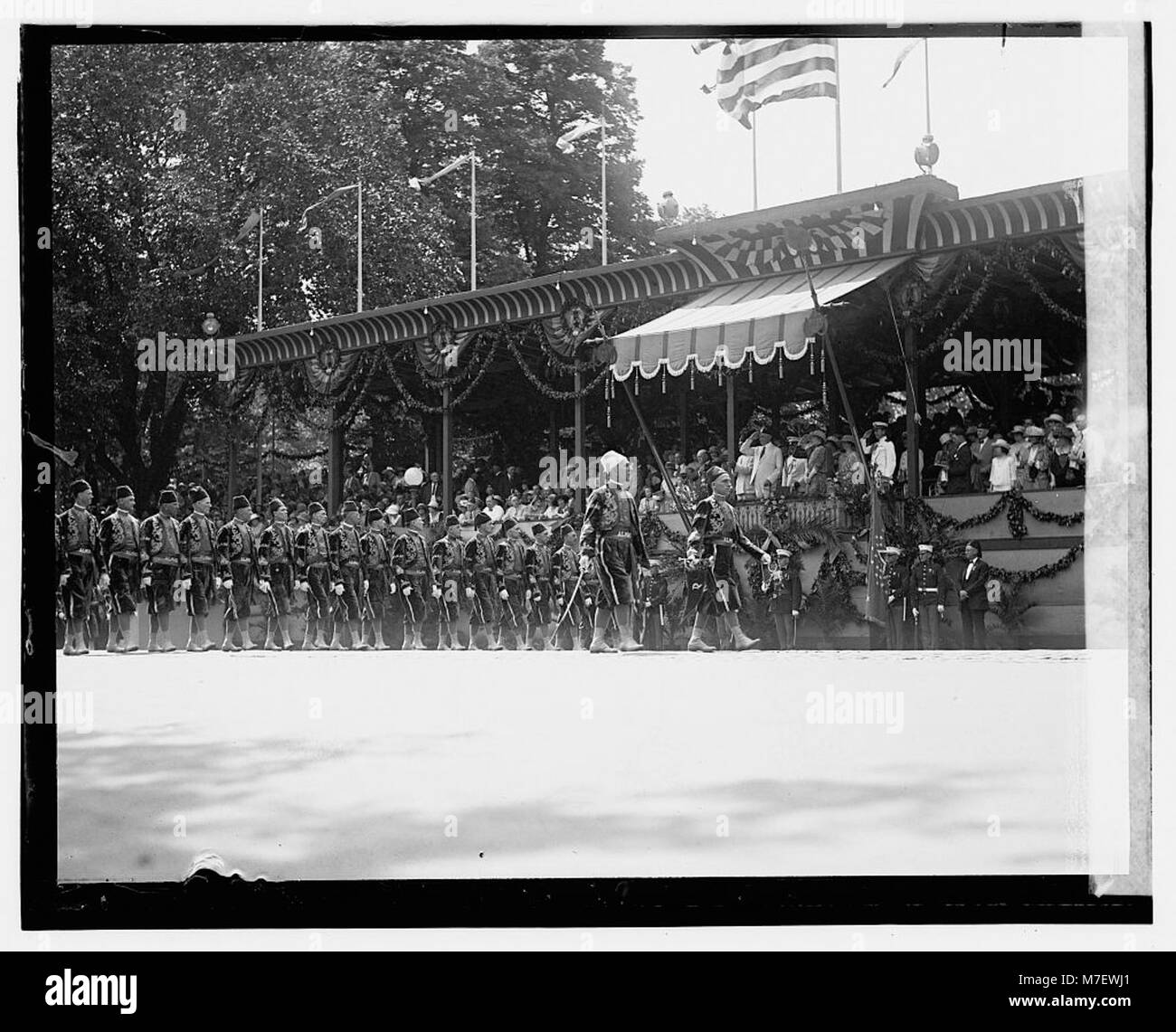 A photograph from a Shriners parade, with participants from Almas ...