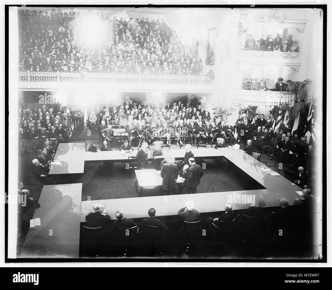 A photograph of the signing of a treaty during an arms conference ...