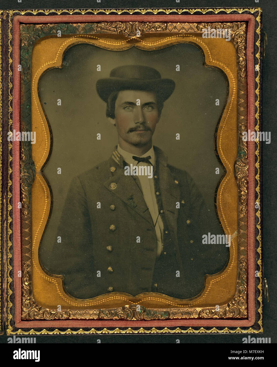 A photograph of a soldier wearing a Confederate captain's uniform ...